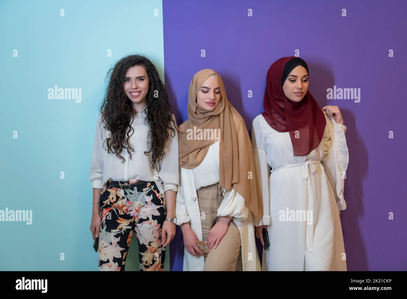 Group portrait of beautiful Muslim women two of them in a fashionable ...