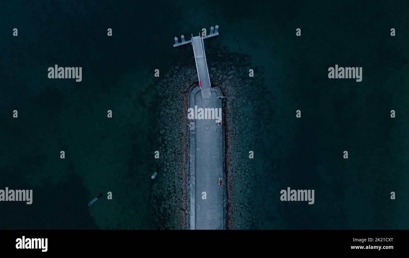 An aerial shot of a walkway going out towards a viewing point ...