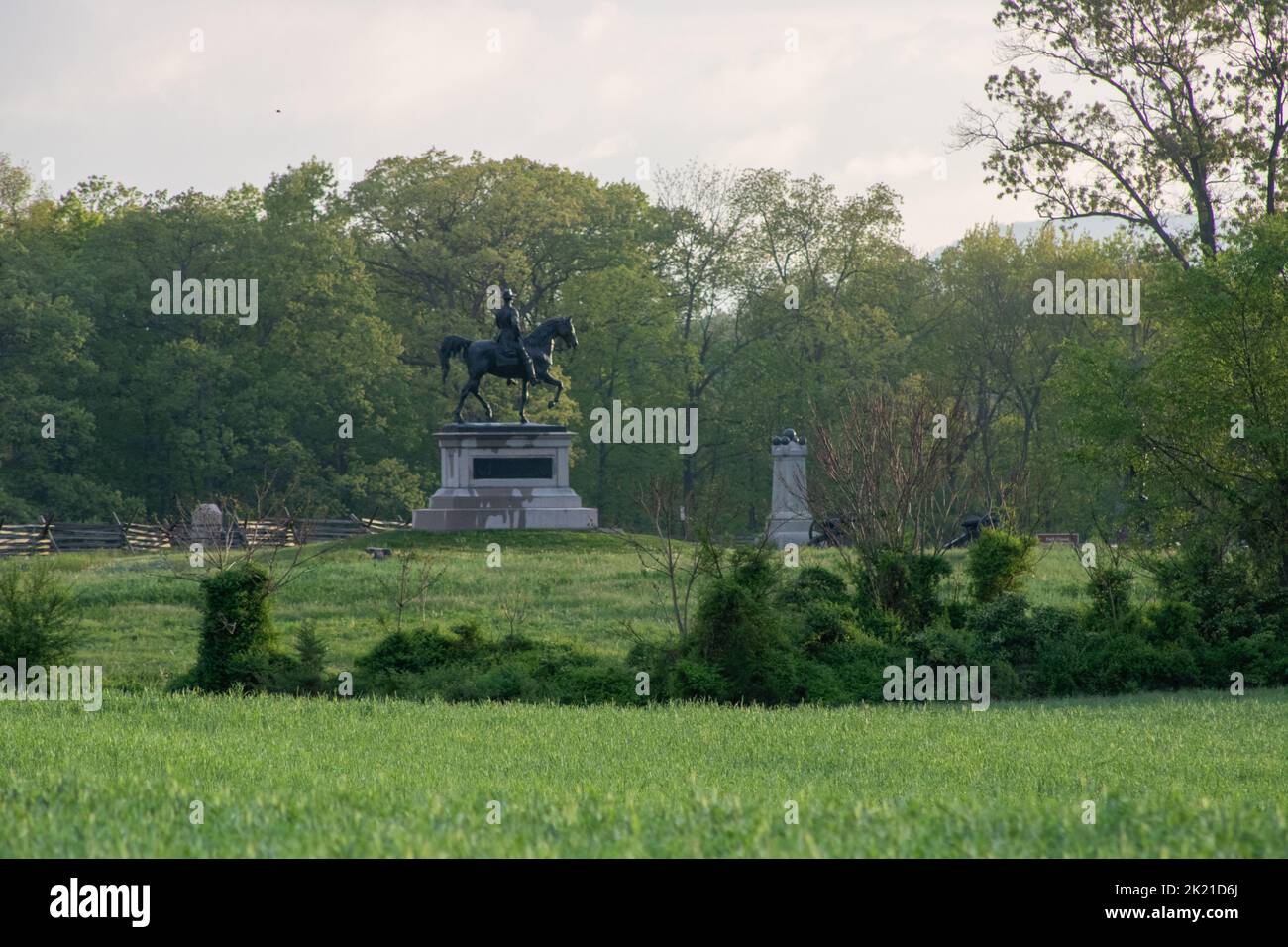 A scenic view of the Gettysburg Battlefield statue surrounded by open ...