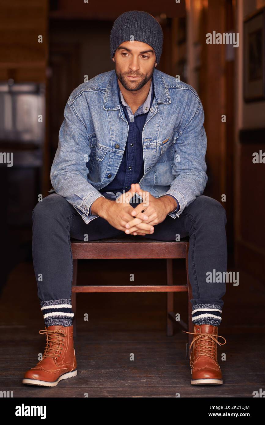 Style is a way of saying who you are. a handsome young man relaxing in ...