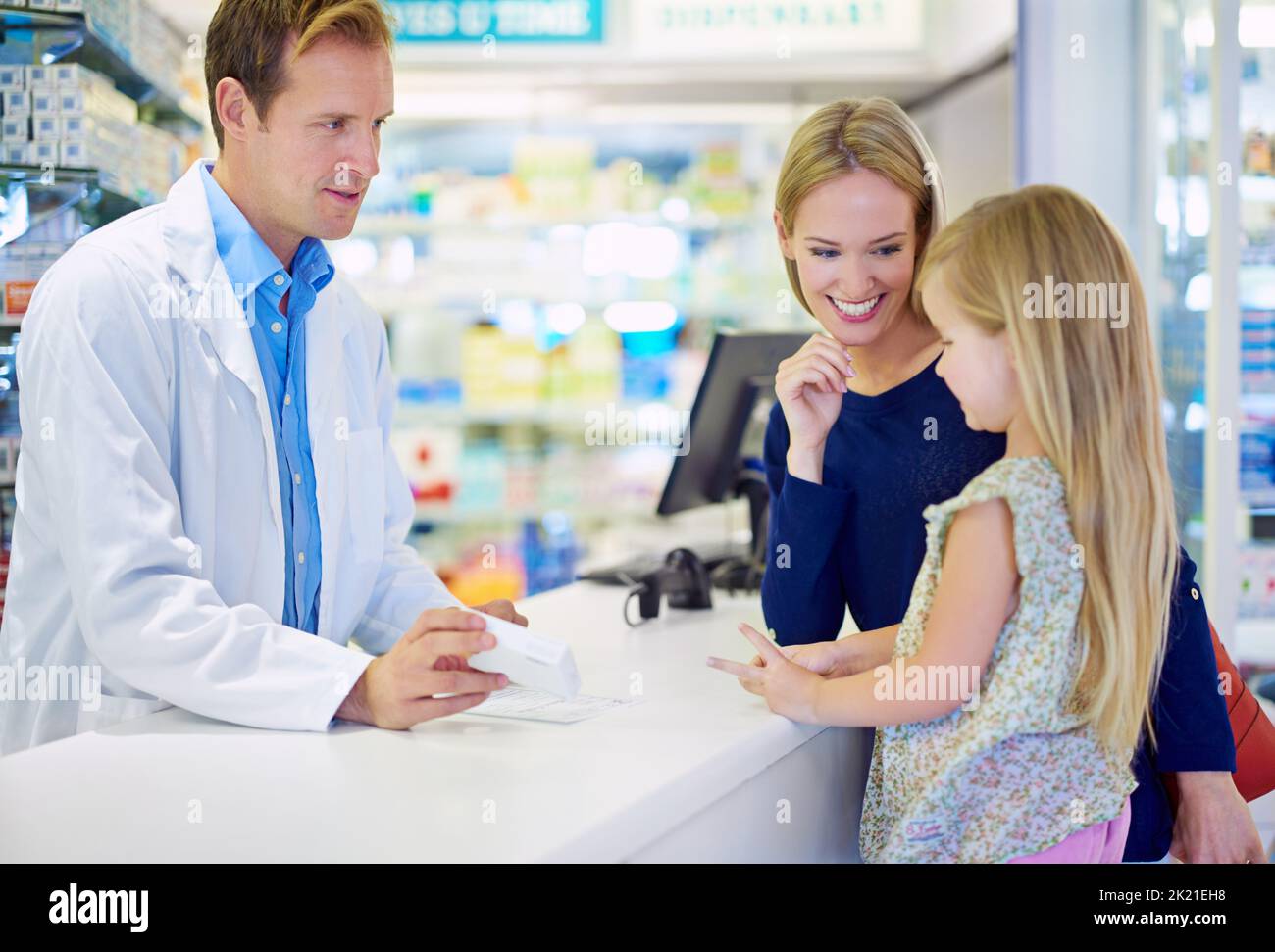 Shell be feeling better in no time. A pharmacist giving medication to a ...