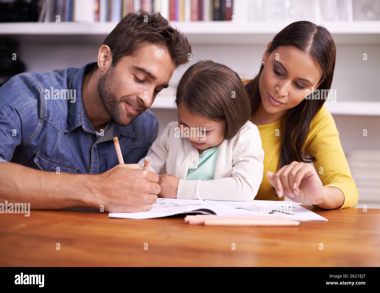 Lets draw you a cupcake. A little girl drawing something with her ...