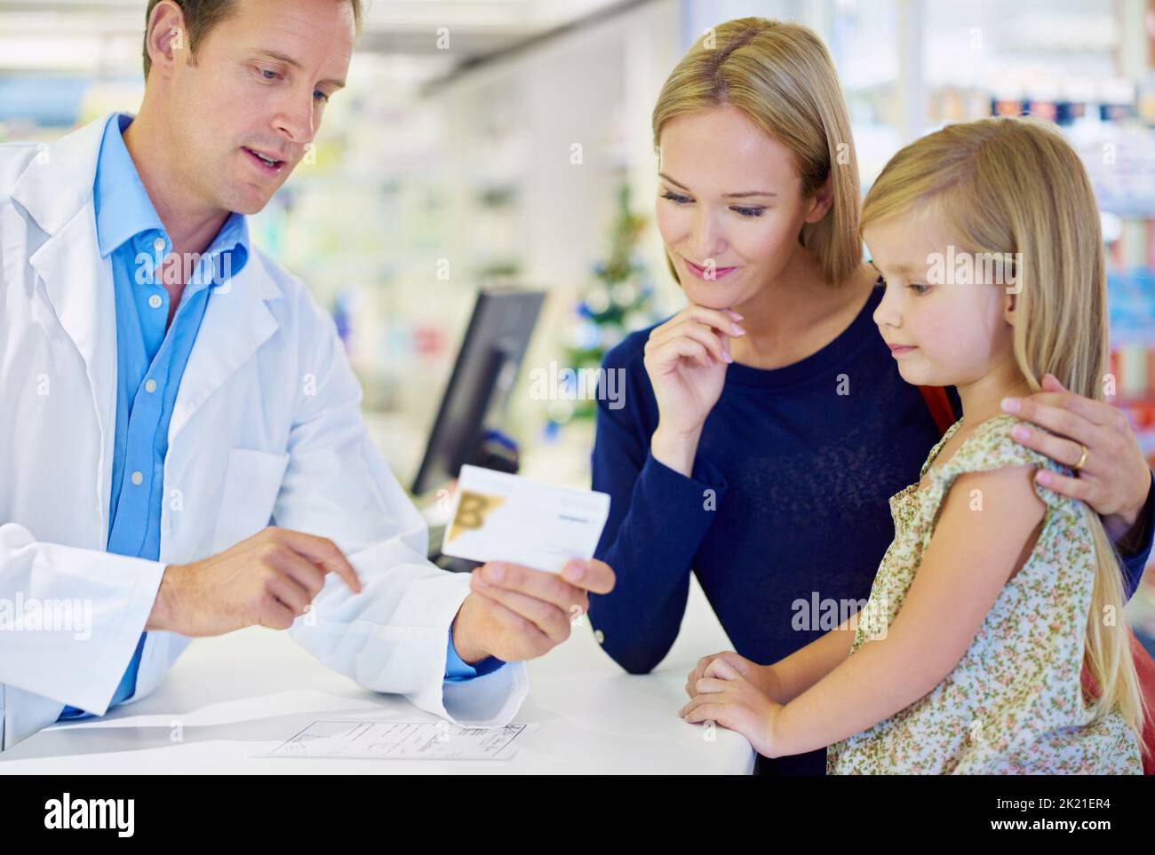 Shell be better before you know it. A pharmacist giving medication to a ...