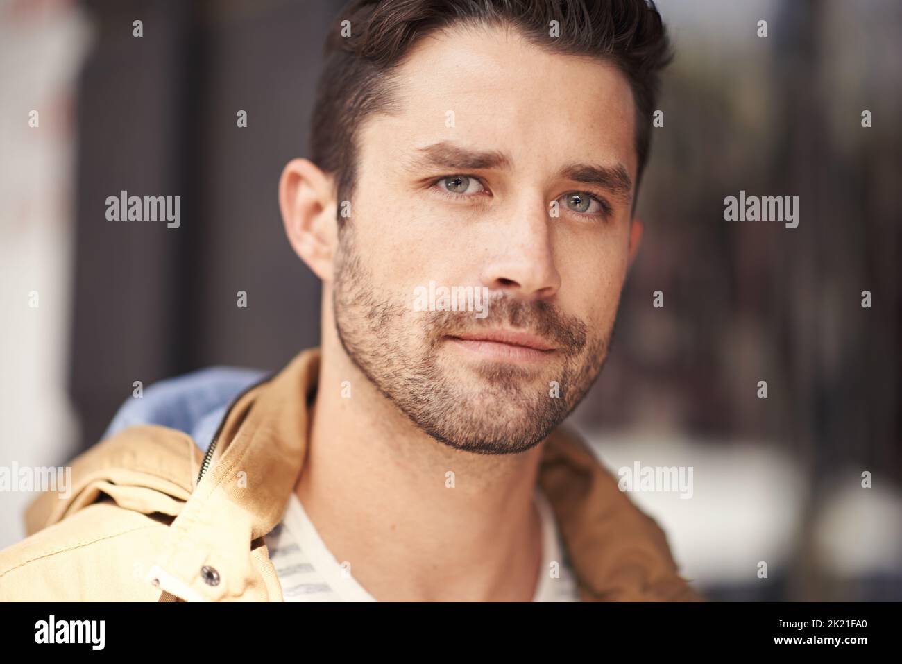 Serious man standing outdoors hi-res stock photography and images - Alamy