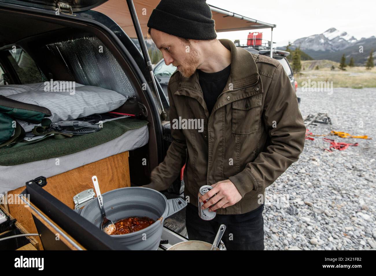 Man holding can beer real hi-res stock photography and images - Alamy