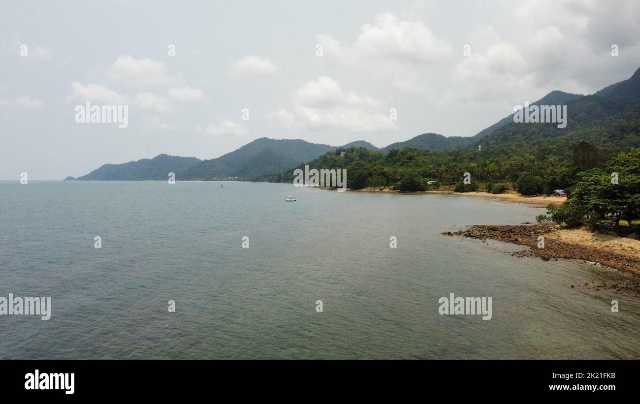 A drone view of Koh Chang island in Thailand with forests and hills in ...