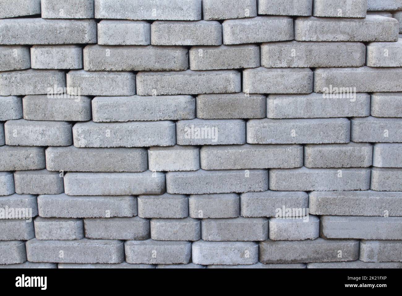 Defocus brick tiles stacked on a pallet. Gray pavement bricks for ...