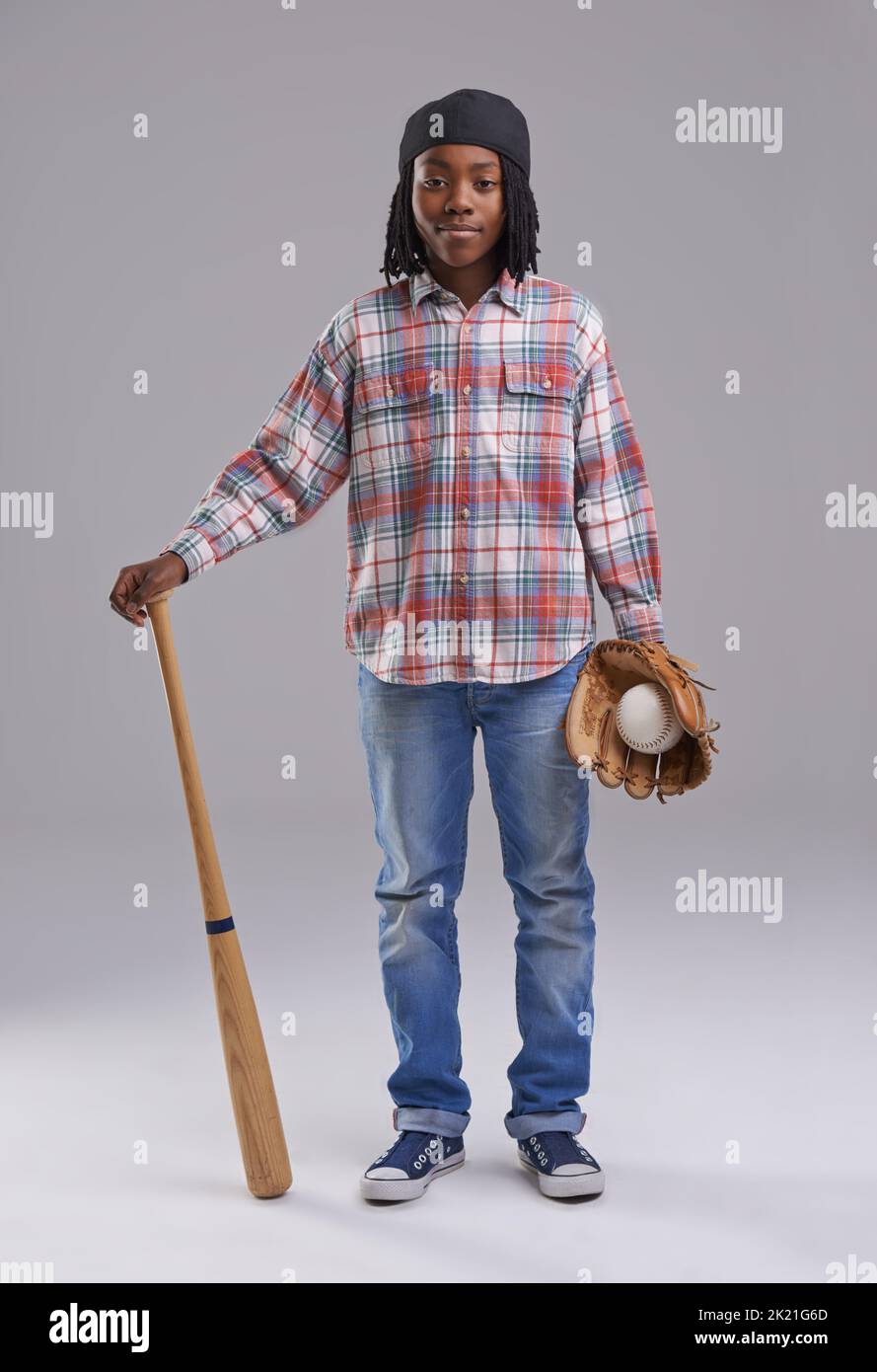 Ready for baseball. Studio shot of a young boy with baseball gear Stock ...