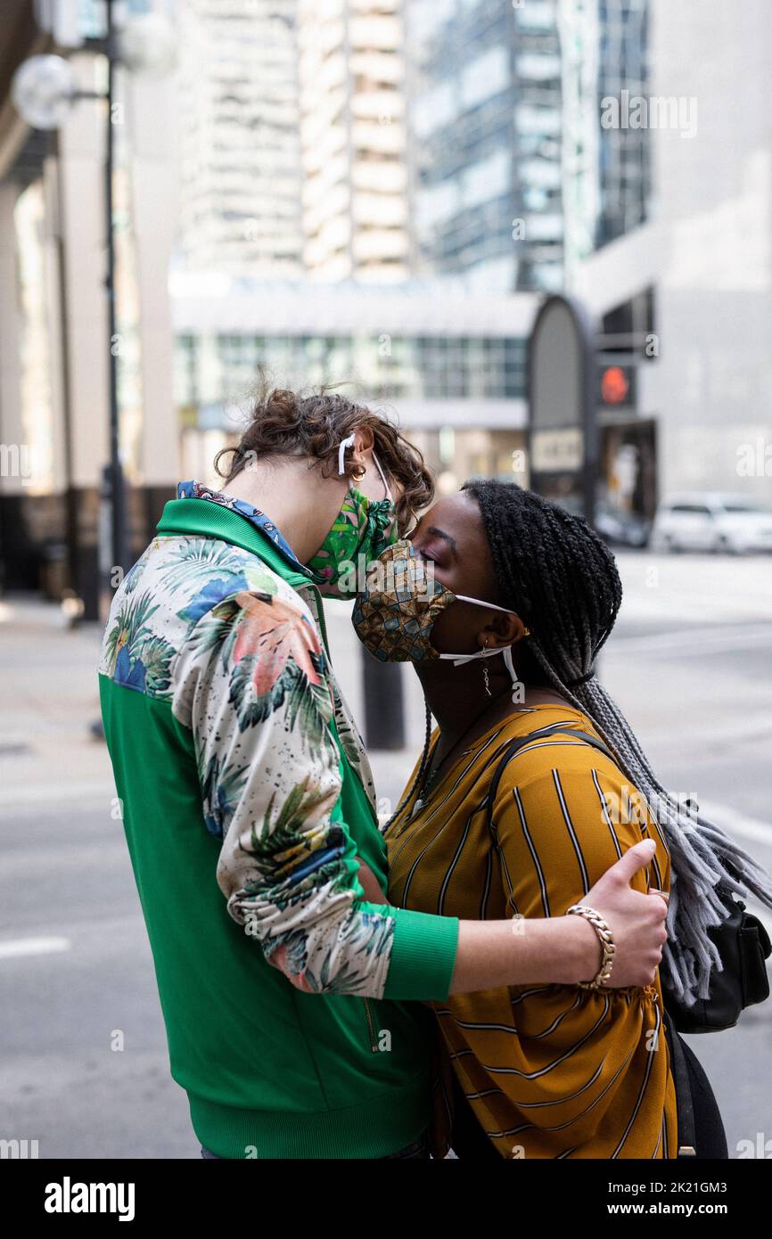 Black couple kissing face masks hi-res stock photography and images - Alamy