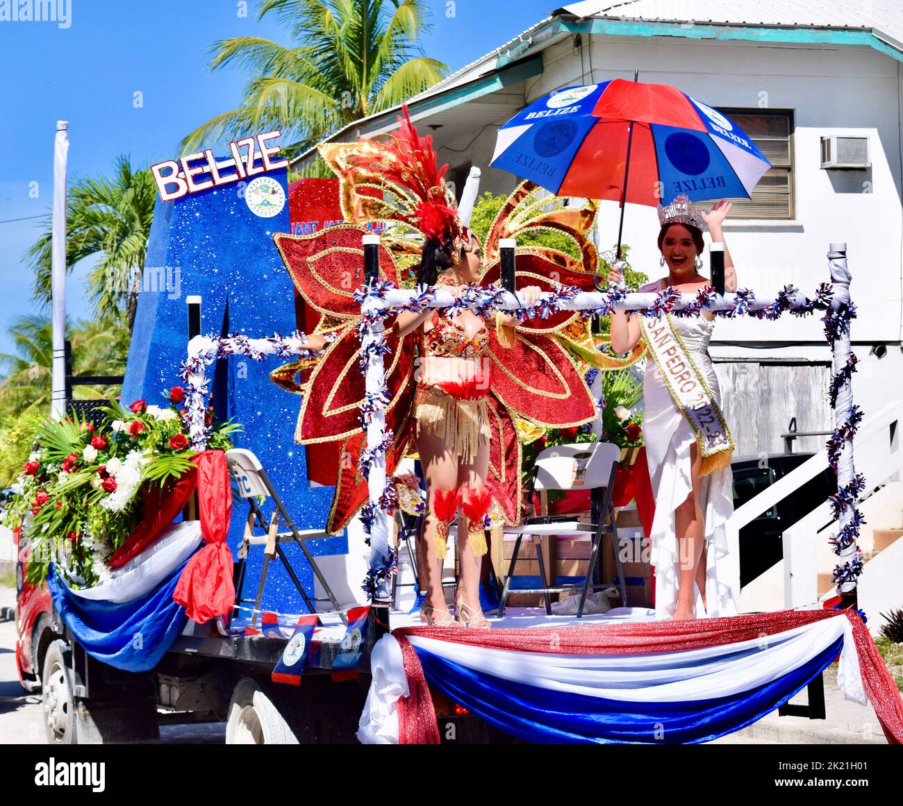The Miss San Pedro 2022 float, with Miss San Pedro in white and waving ...