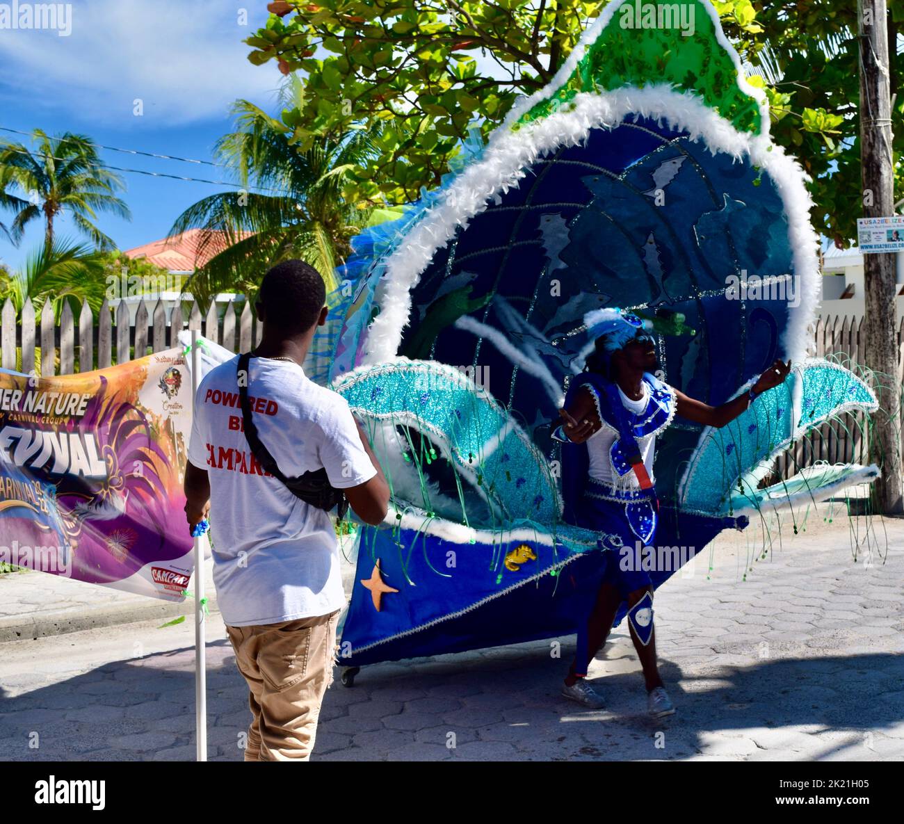 A male, Belizean dancer in an elaborate, blue, underwater-themed ...