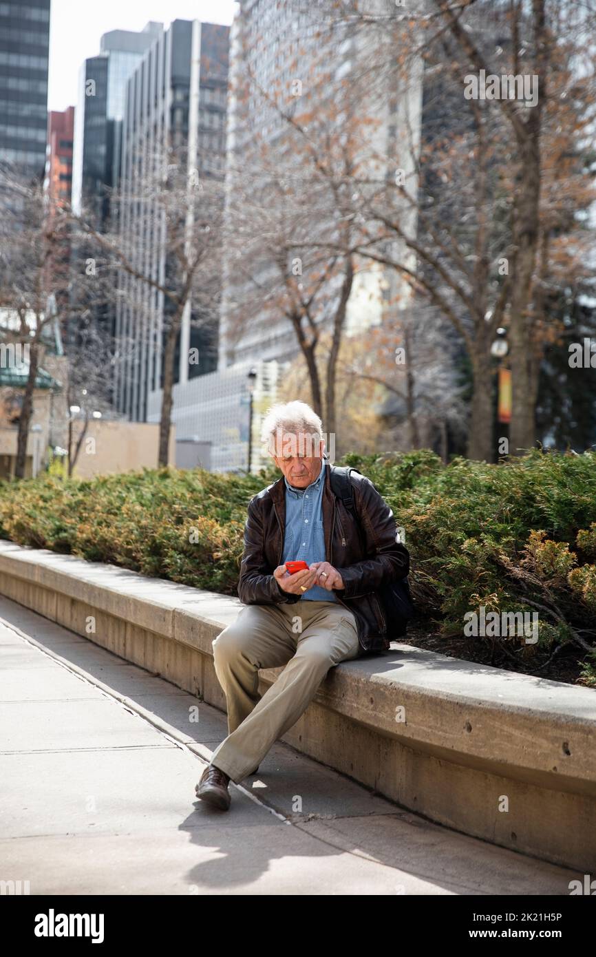 Smart man in park hi-res stock photography and images - Alamy