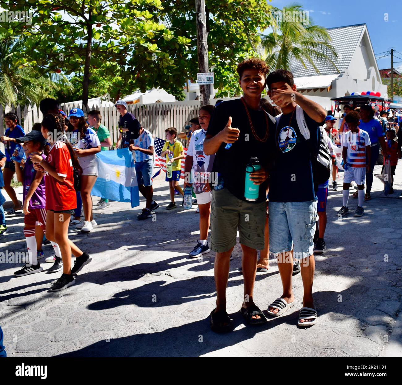 Two young Belizean men, posing for the camera, having fun in the San ...