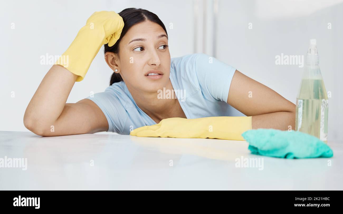 Stress, annoyed or bored woman with cleaning, housekeeping product and ...