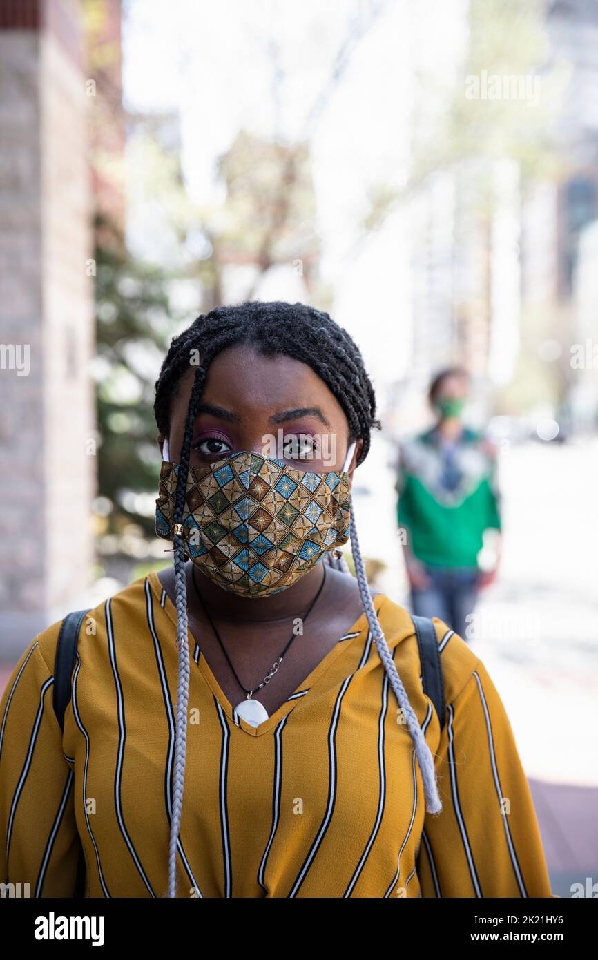 Portrait teenage girl in face mask on sidewalk Stock Photo - Alamy