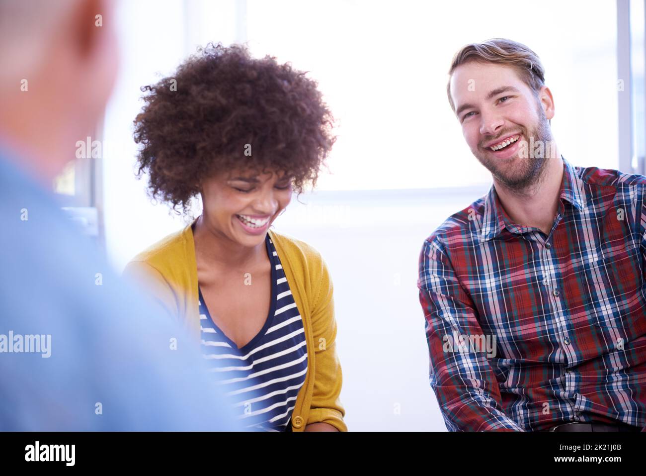 Glowing with praise. a group of coworkers in a meeting Stock Photo - Alamy