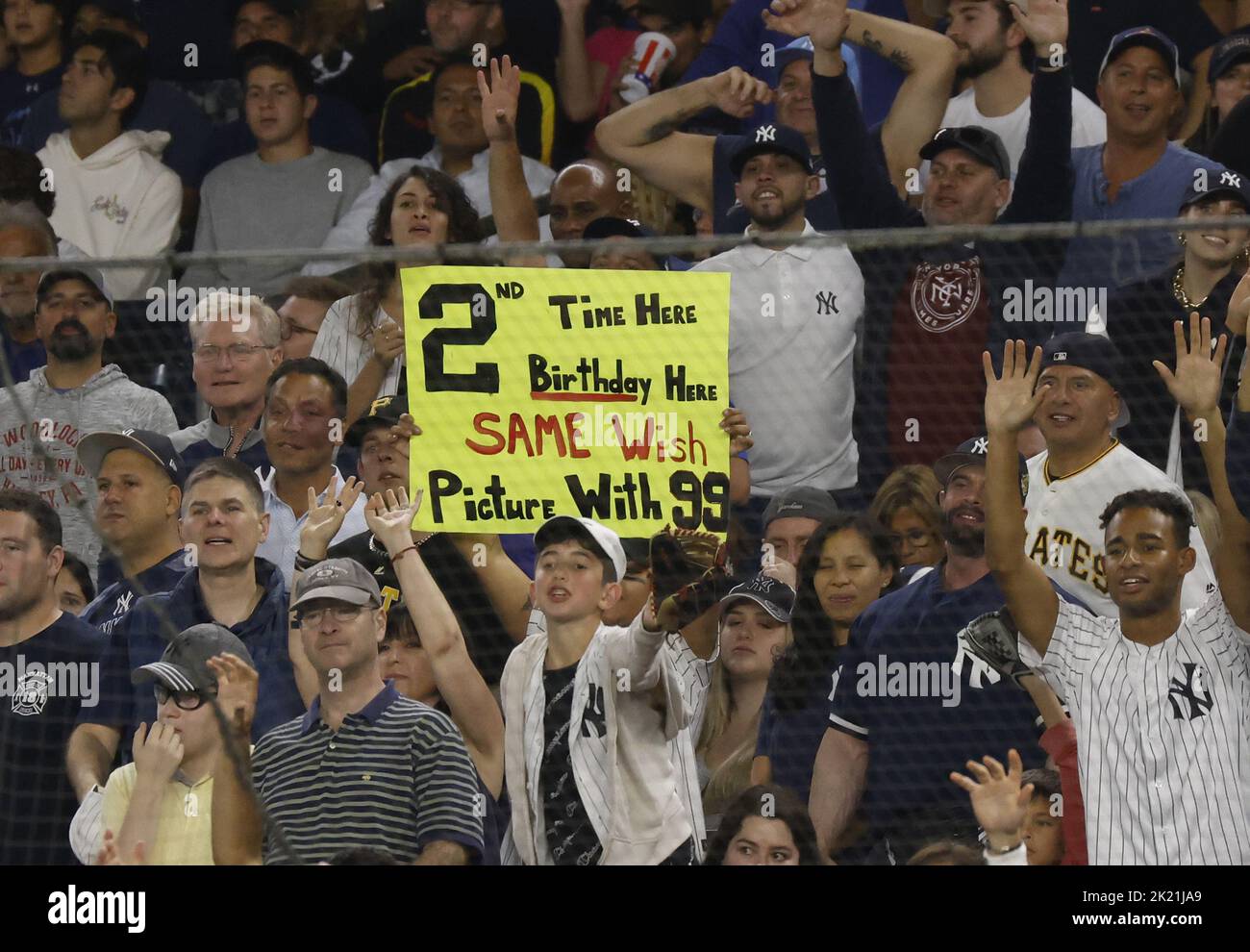 New York Yankees fans hold a sign asking for a picture with Yankee ...