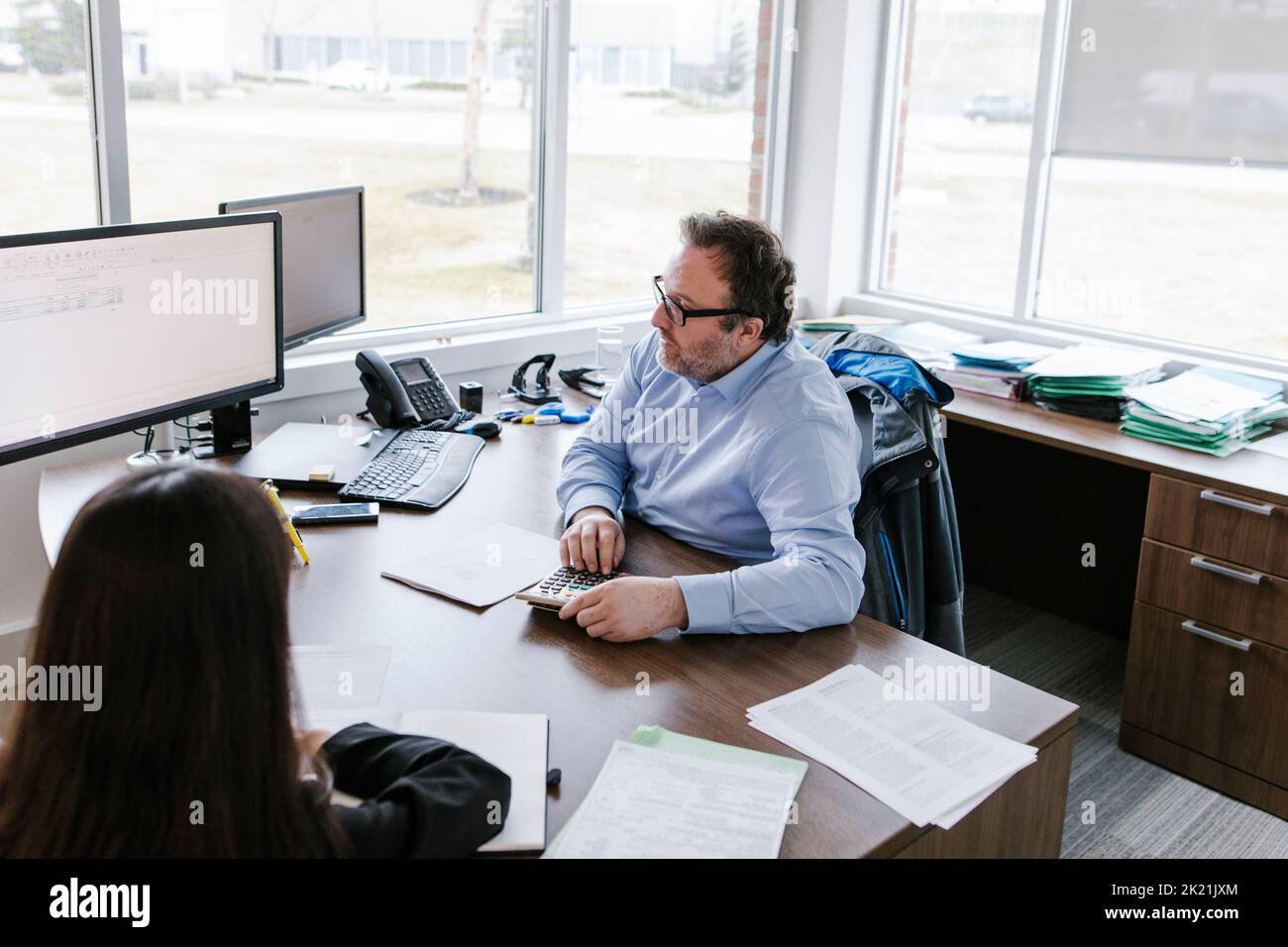 Man employee calculator hi-res stock photography and images - Alamy