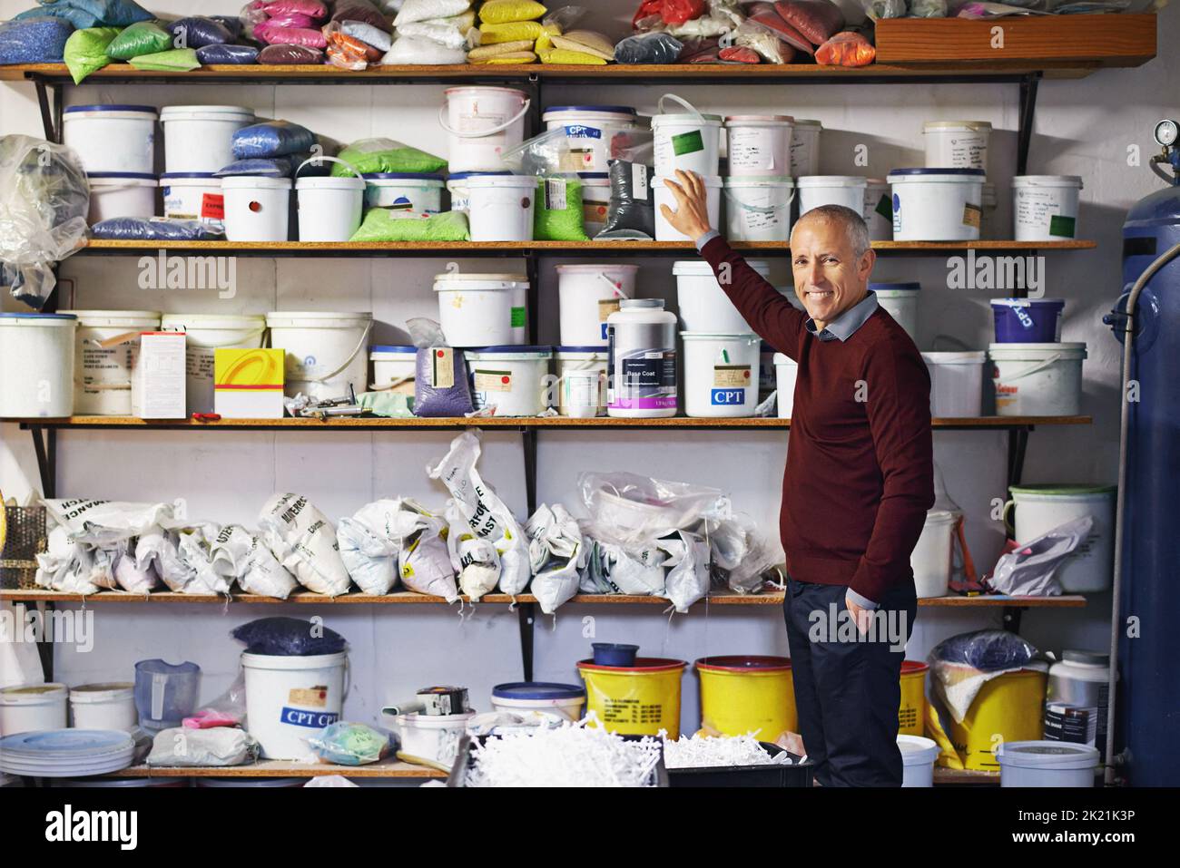 For all your crafting needs. a store owner standing in front of his ...