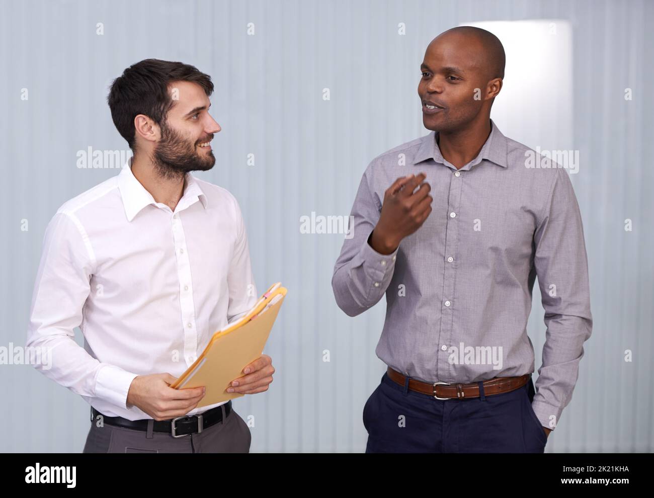 Sharing the secrets to success. two businessmen having a discussion ...