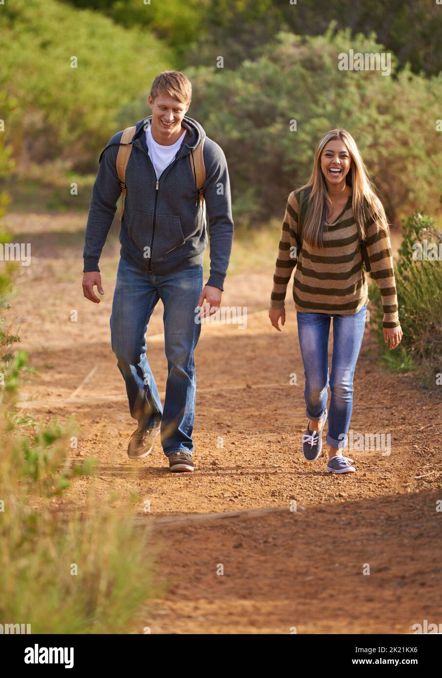 Getting away from it all together. a happy young couple walking on a ...