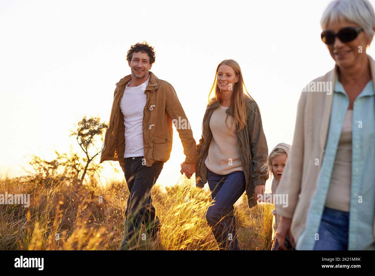 Getting some crisp morning air. a happy family out on a morning walk ...