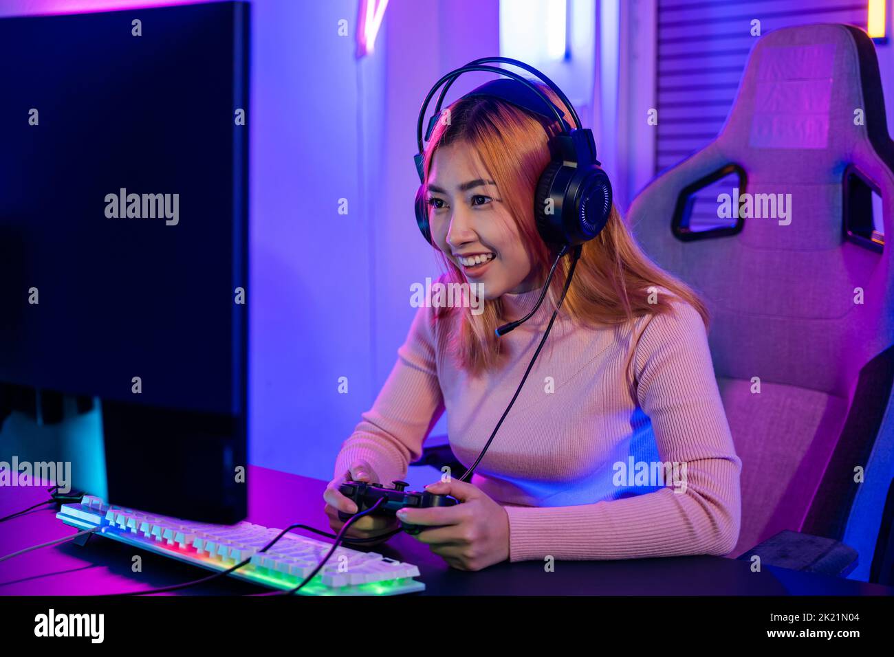 You win. Gamer using joystick controller plays online video game with ...