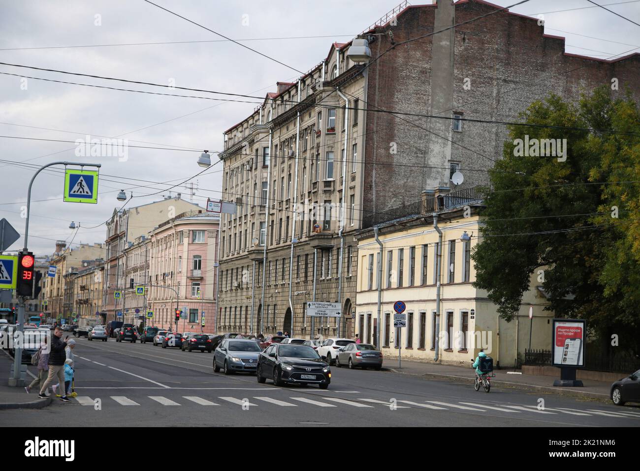 Several cars stopped at the traffic light in the center of St ...
