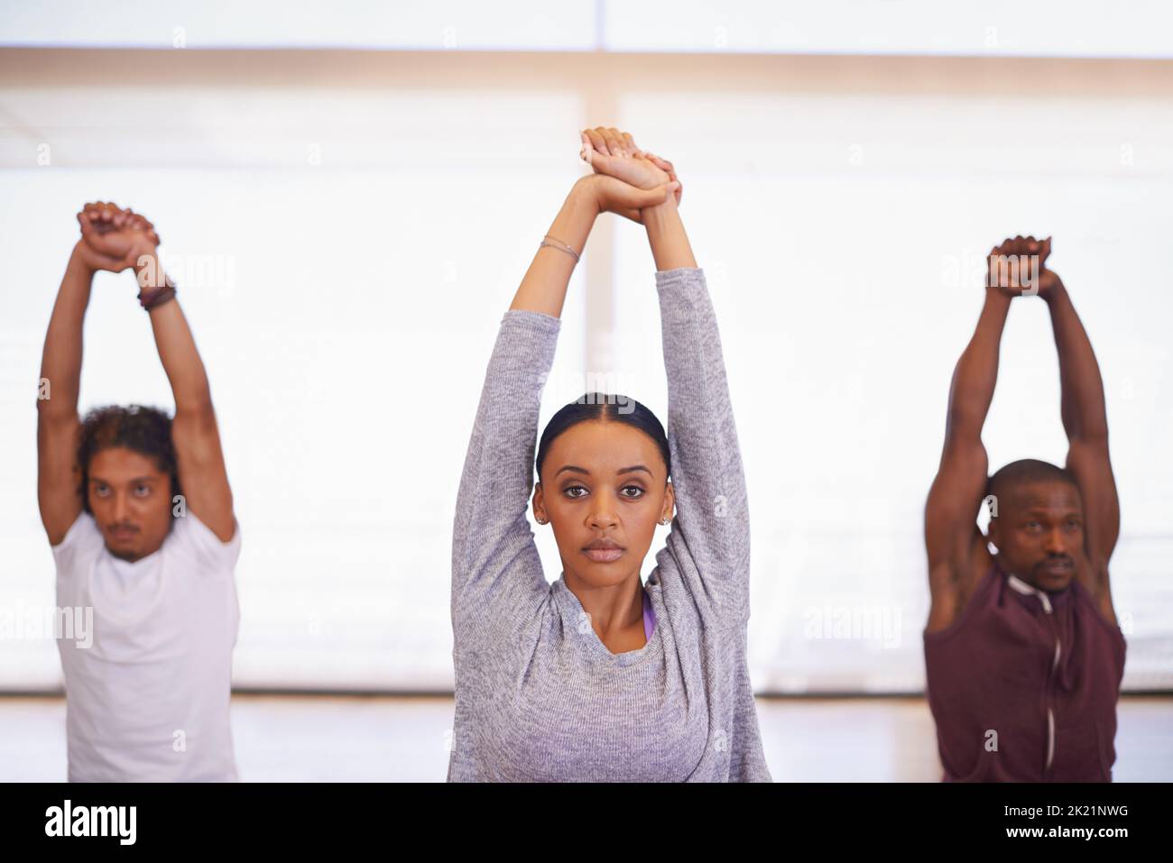 In the middle of an awesome workout. a group of young dancers ...