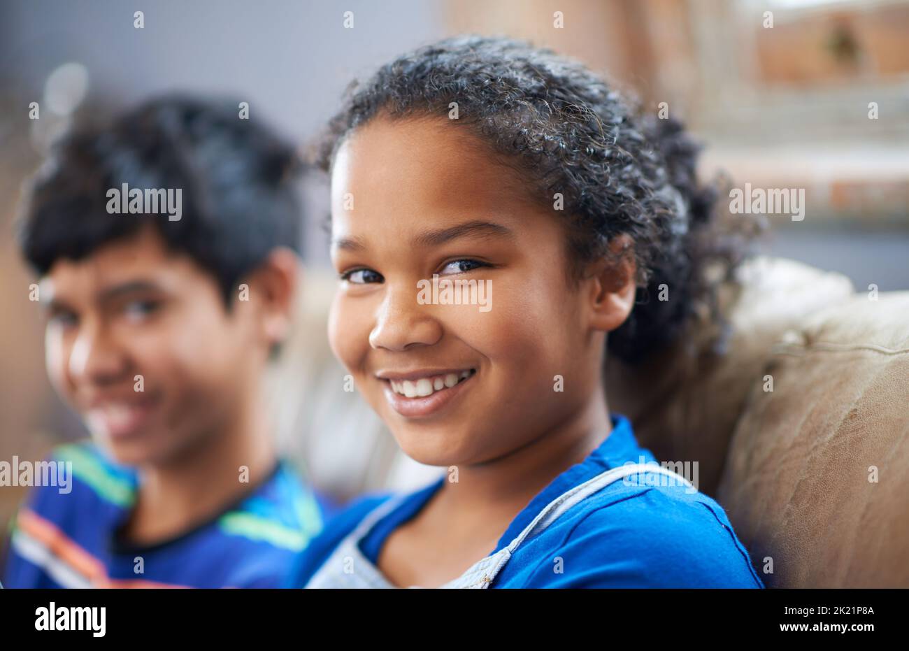 Chilling with my bro. Portrait of a little brother and sister sitting ...