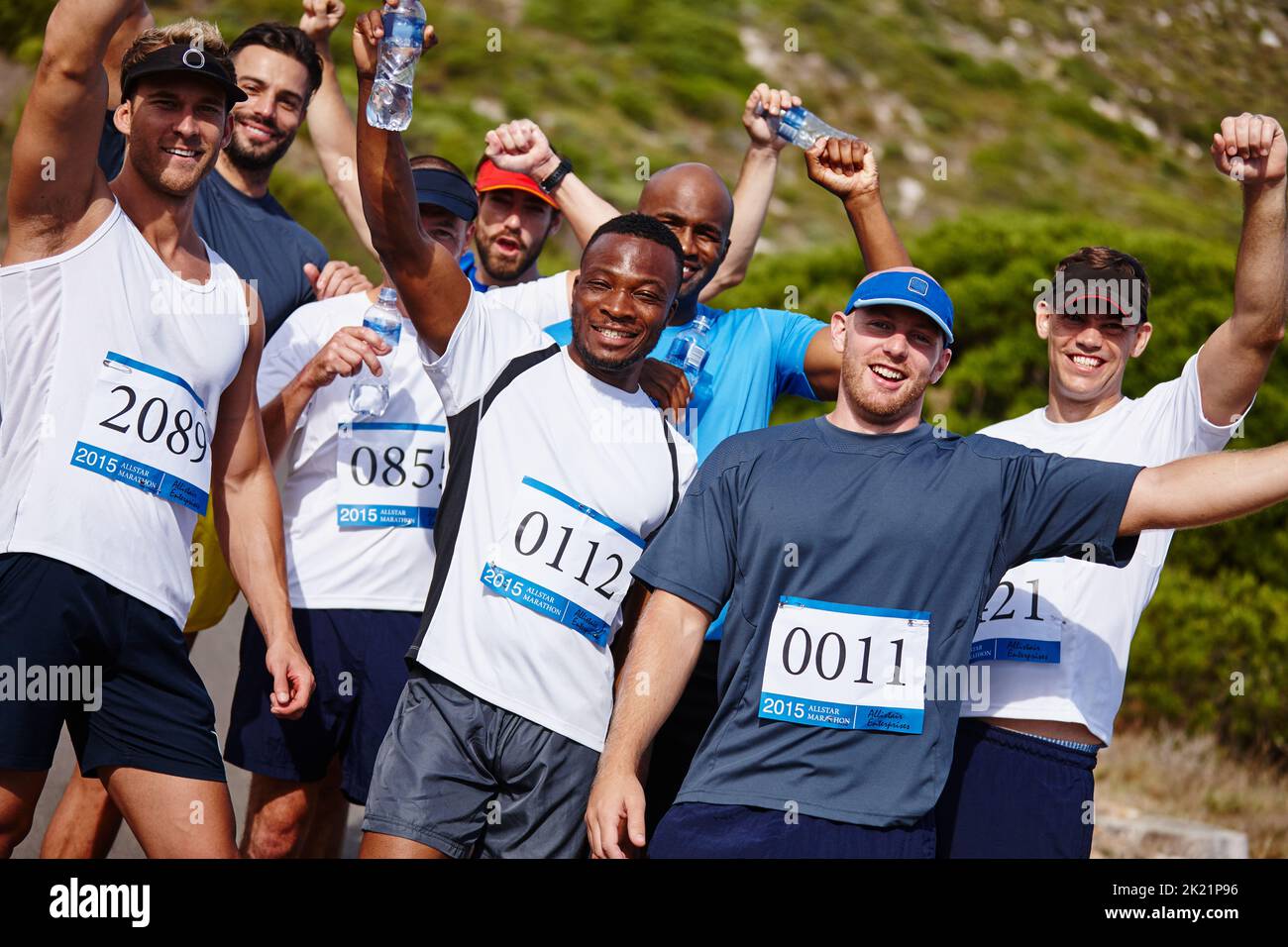 For the win. A group of young men standing together with their water ...