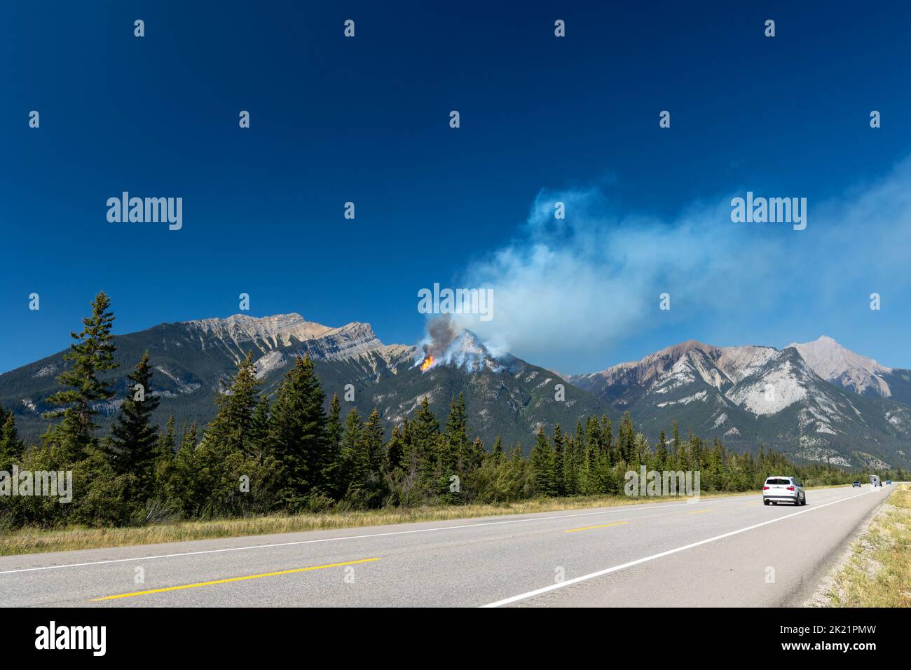 Forest wildfire and smoke on the side of a mountain Stock Photo - Alamy
