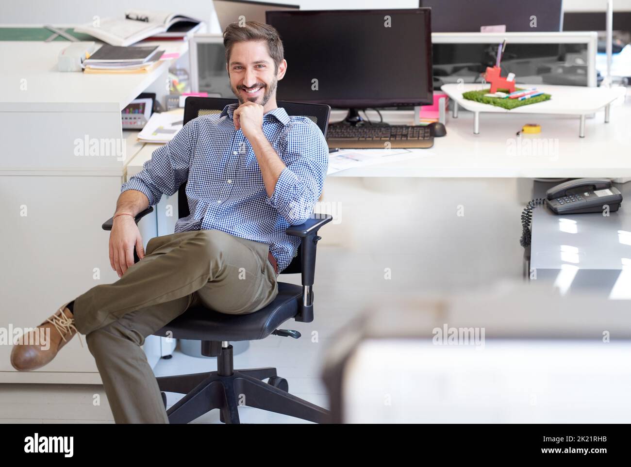 Designing my perfect career. Portrait of a young designer sitting at ...