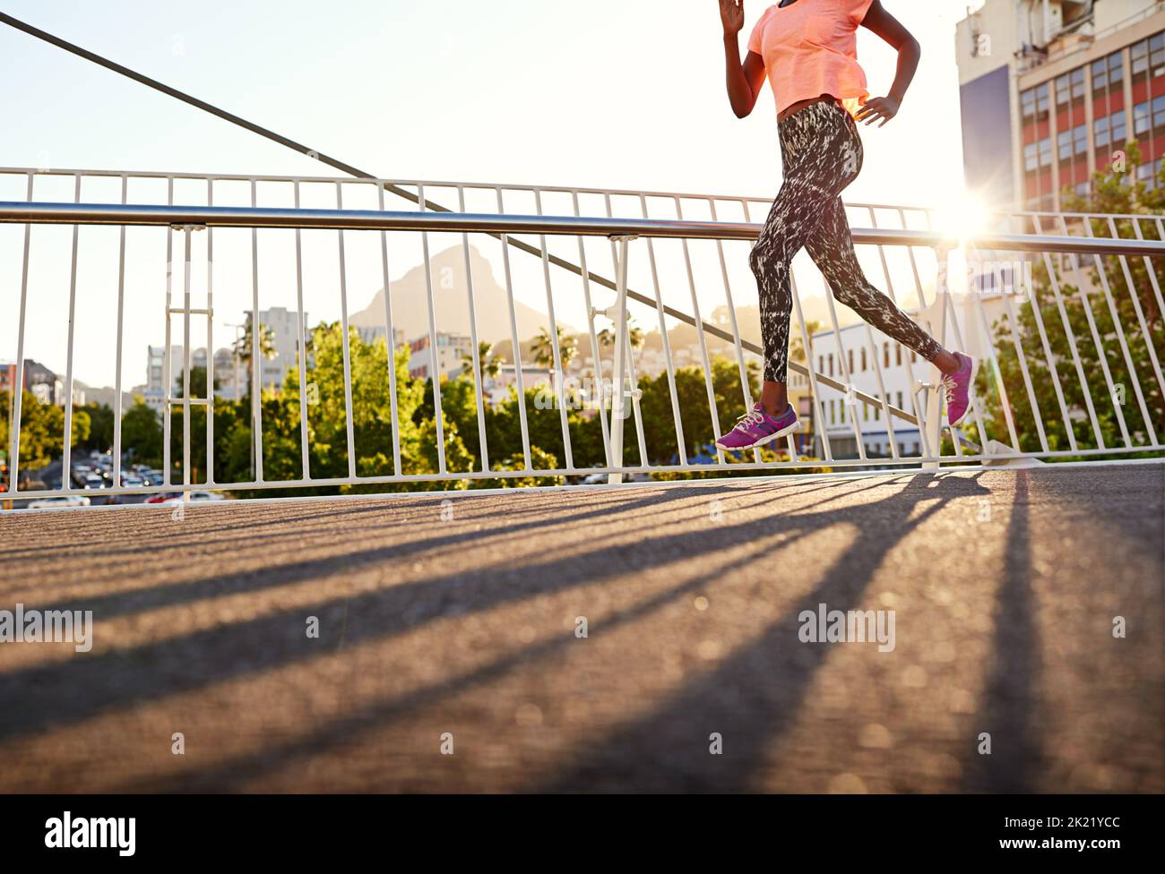 Running in the open air. a female athlete running outdoors Stock Photo ...