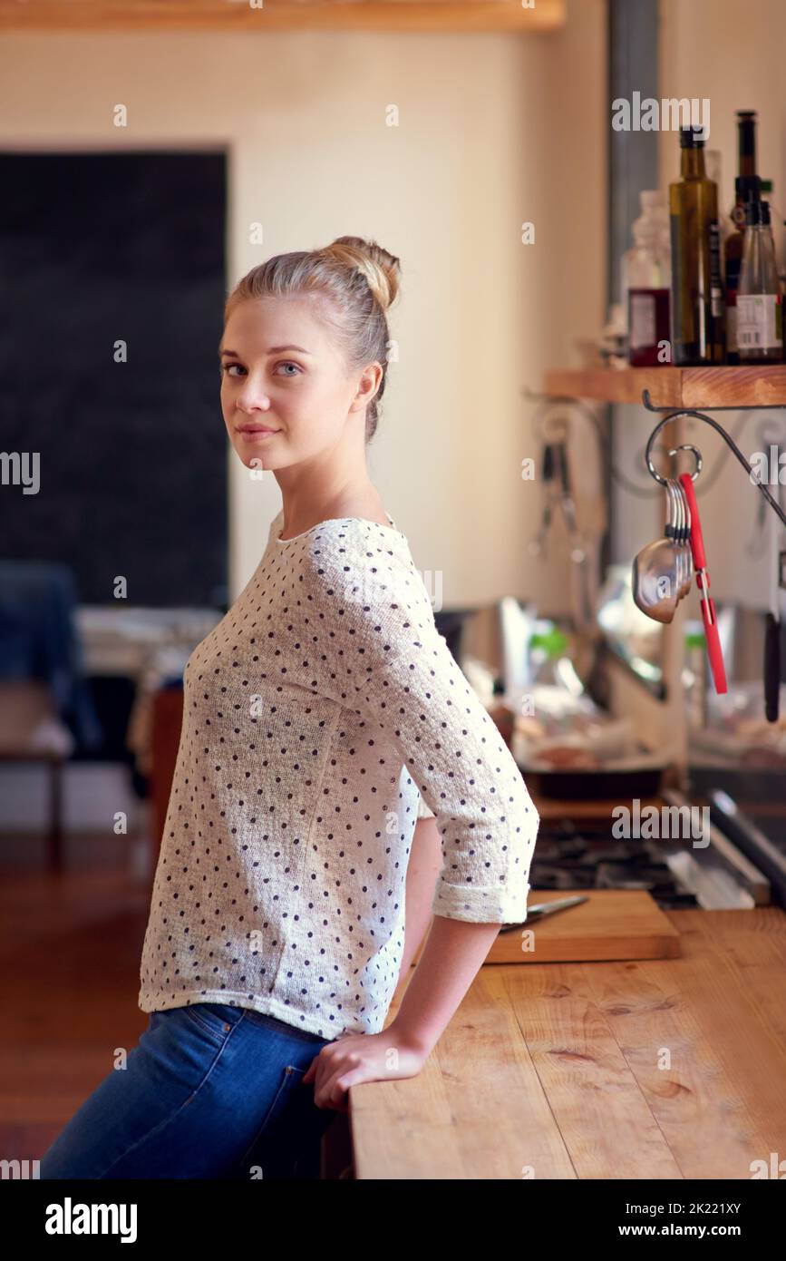 Time to prepare a delcious meal. Portrait of a beautiful young woman in ...