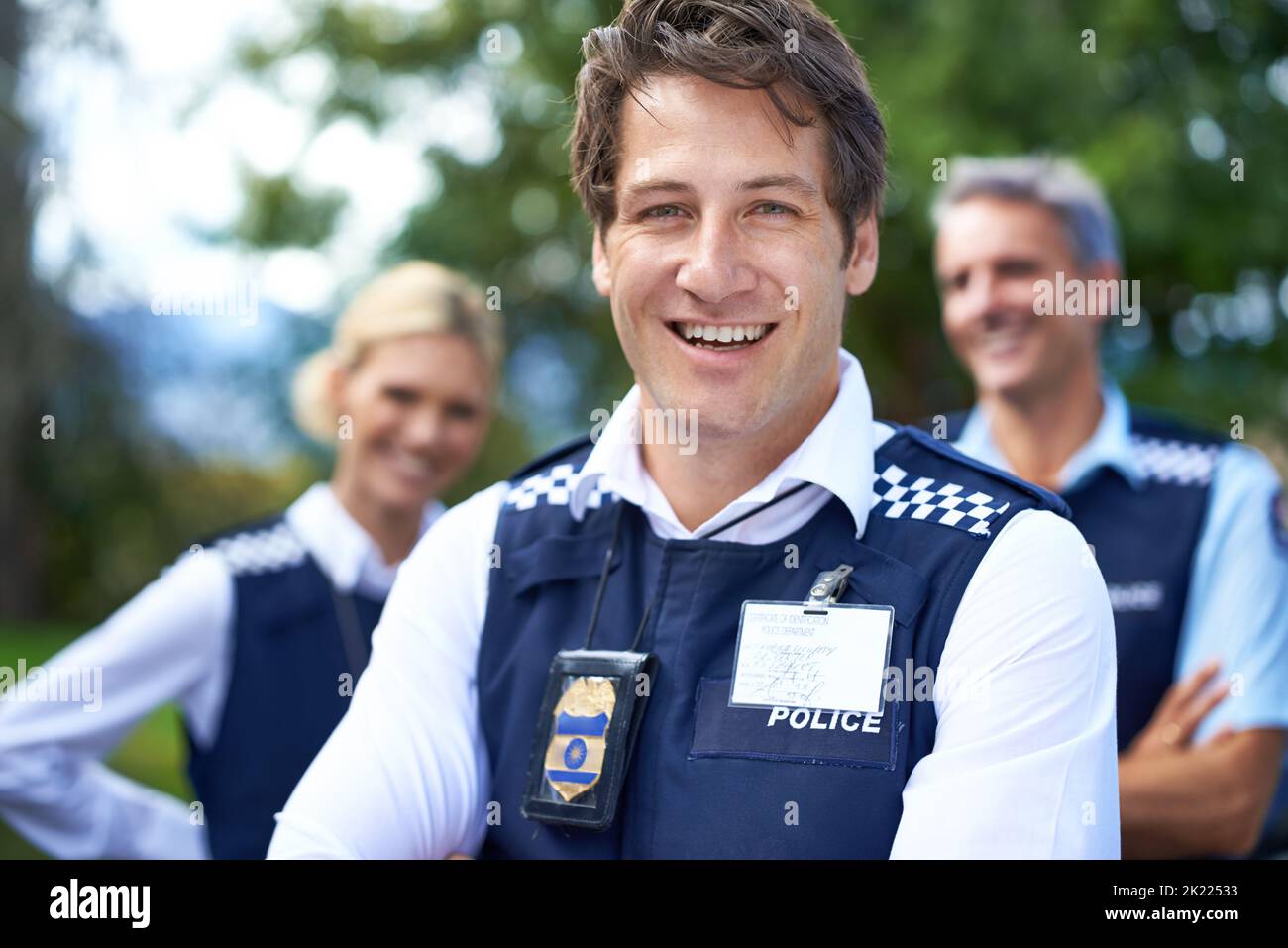 Youre safe with him watching. a group of police on duty Stock Photo - Alamy