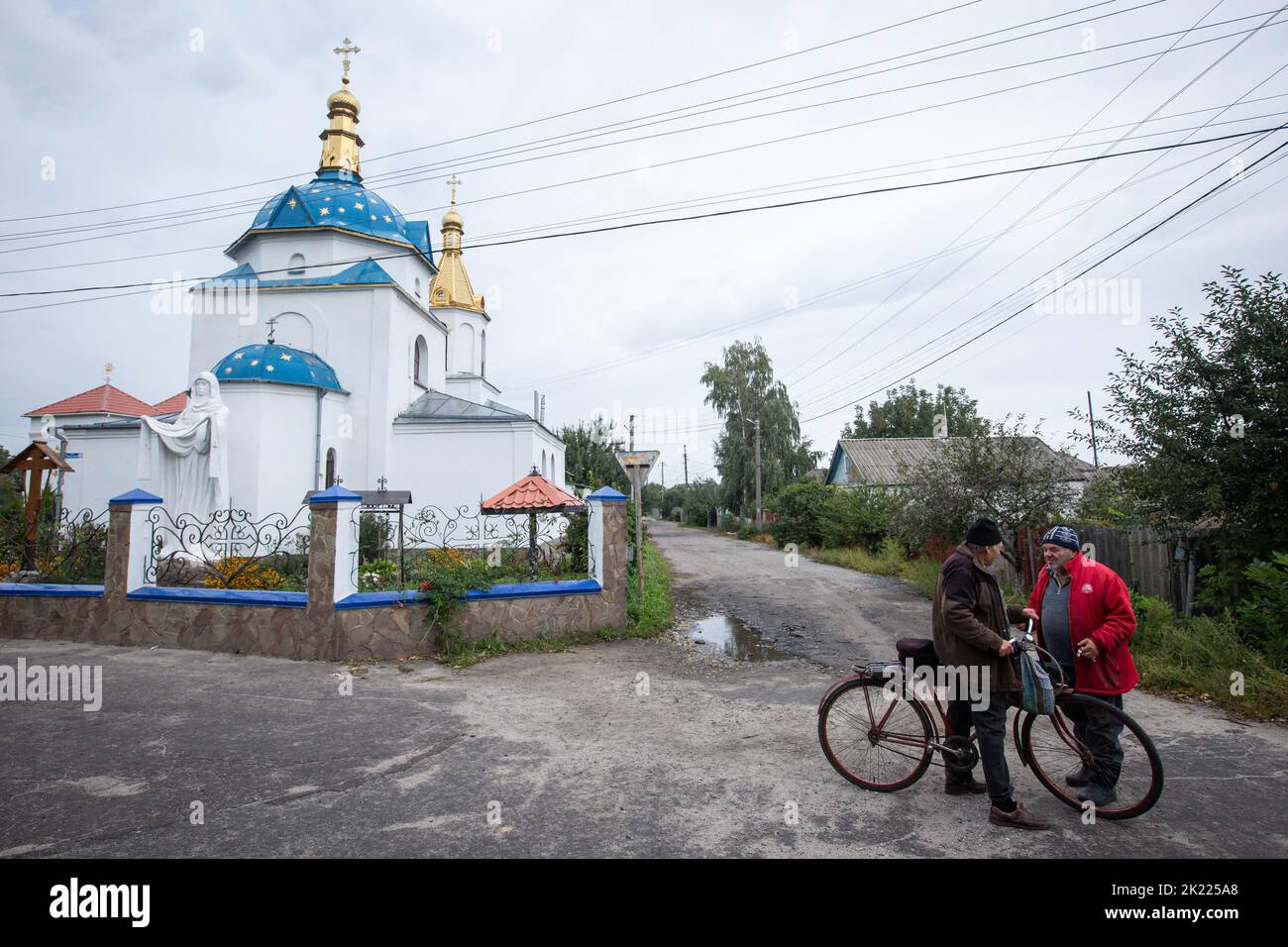 Balakliia, Ukraine, 20 Sept 2022, Local people talking near the church ...
