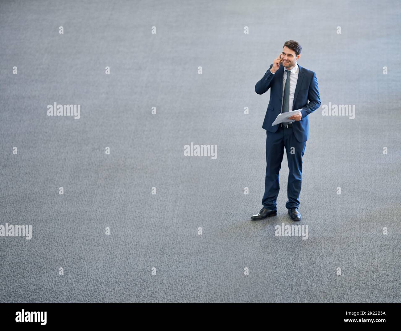 Planning his success. Full length shot of a young businessman making a ...