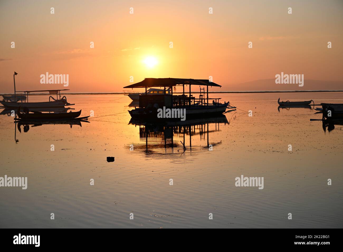 Golden Glow of the sun rising at dawn silhouettes fishing boats at ...