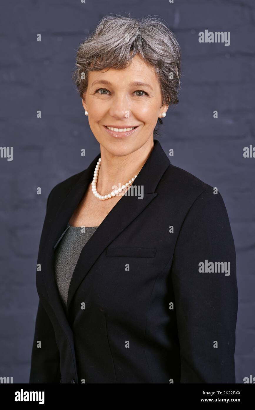 Success has no time clock. Portrait of a senior businesswoman standing ...