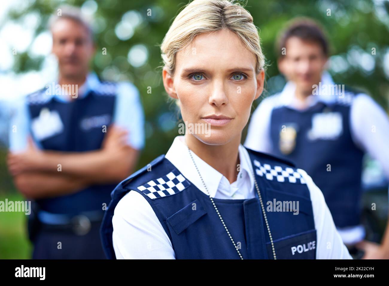 Shes on your case. a serious policewoman with her colleagues in the ...
