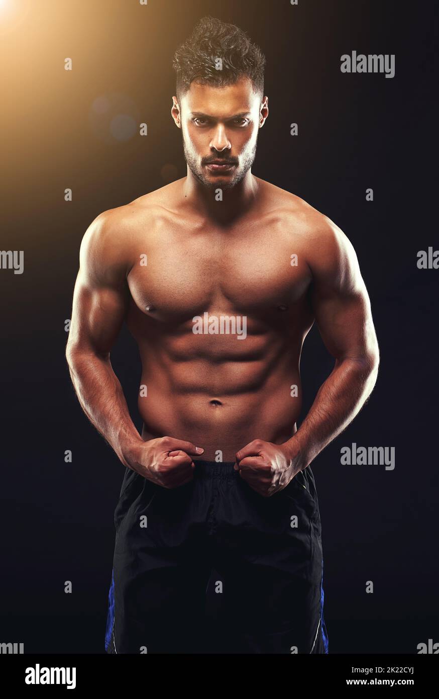 Beast mode ON. Studio shot of a fit young man isolated on black Stock ...