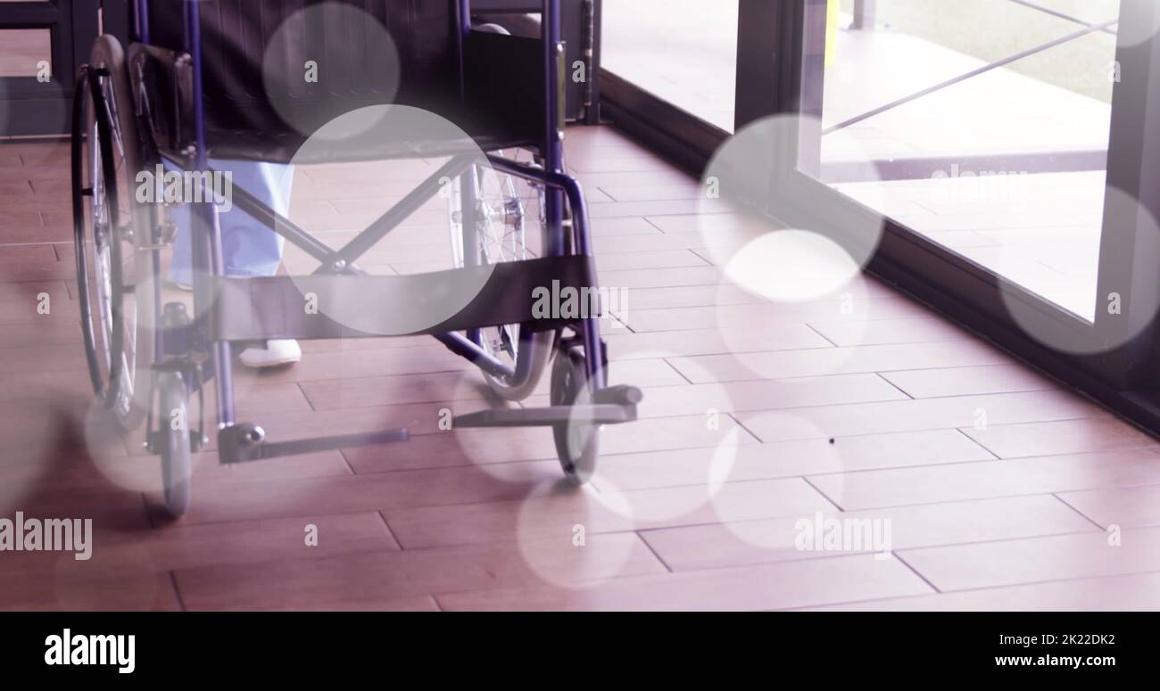 Image of spots over wheelchair Stock Photo - Alamy
