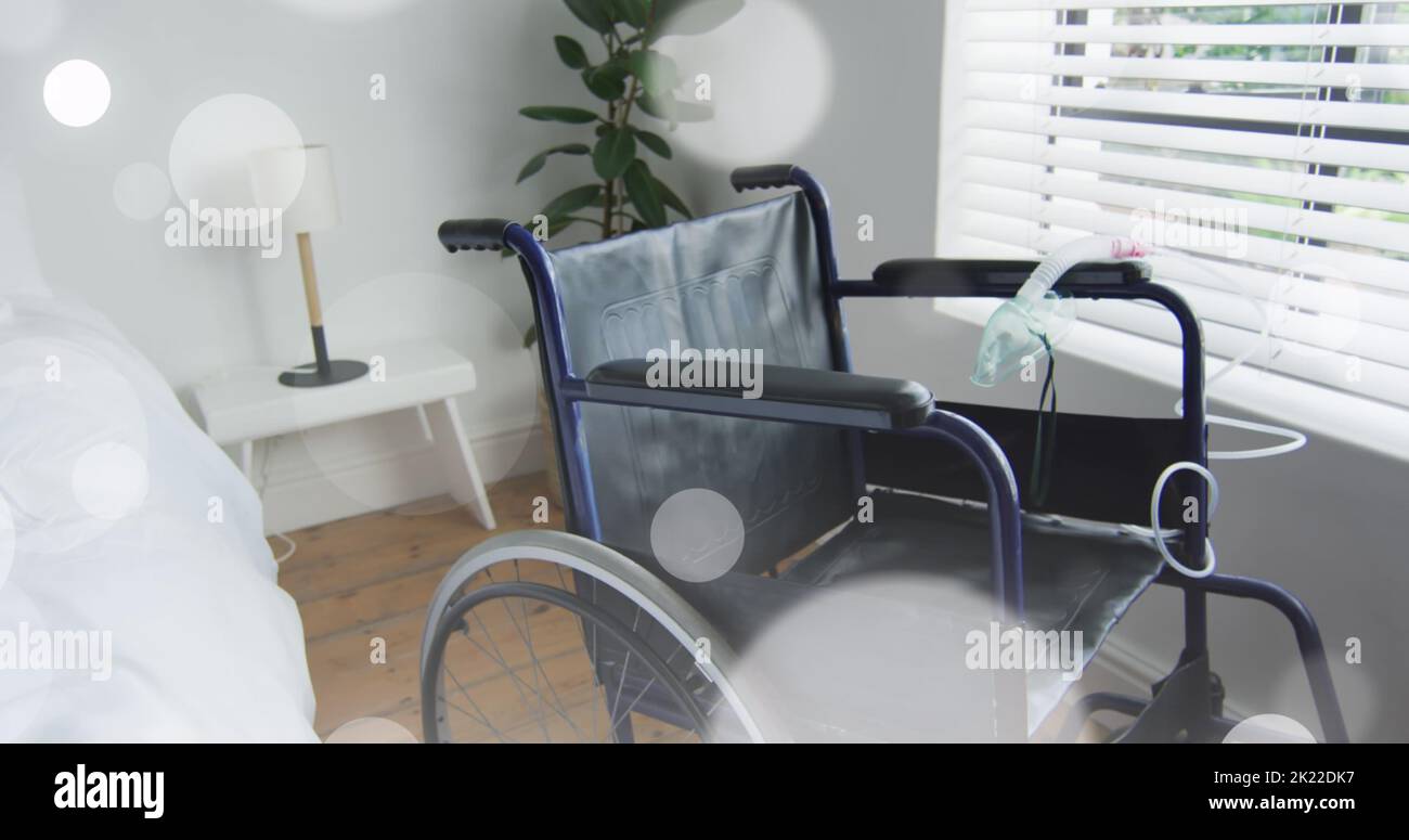 Image of spots over wheelchair Stock Photo - Alamy
