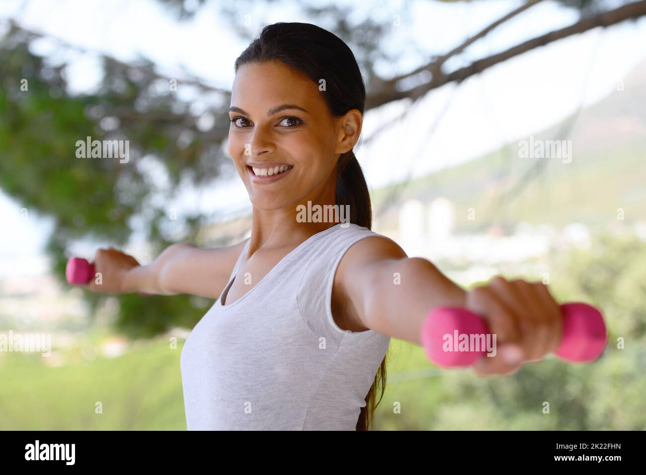 Im busy getting stronger. Portrait of a beautiful woman lifting ...