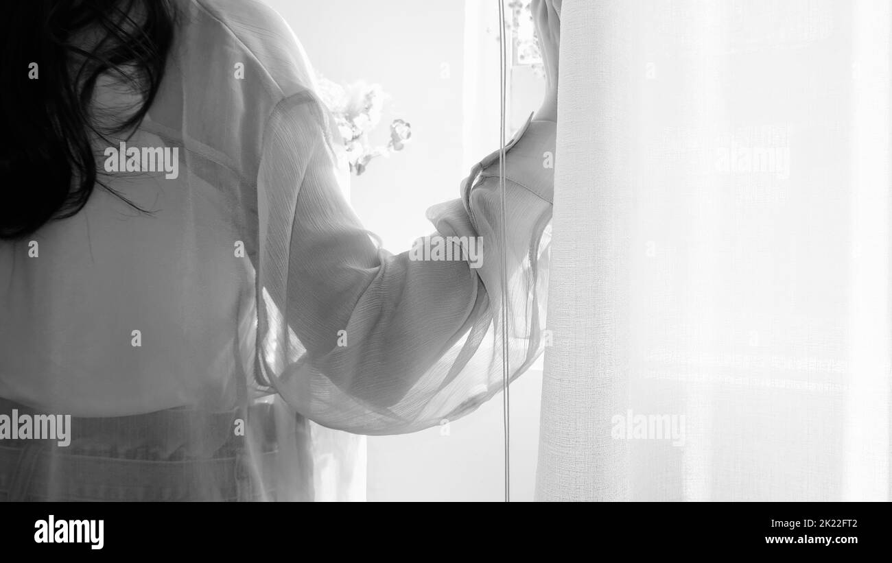 Woman window back view Black and White Stock Photos & Images - Alamy