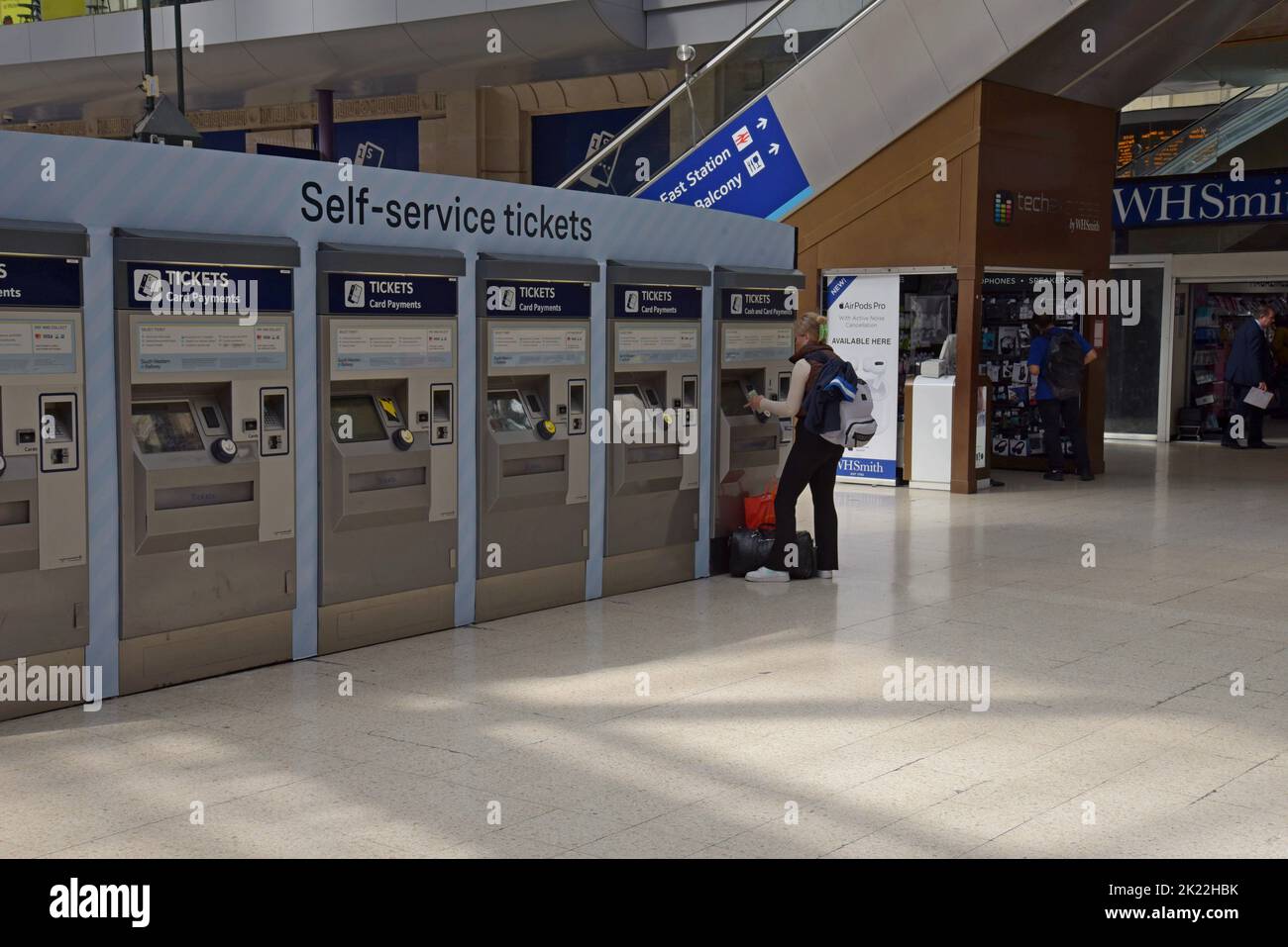 Passengers buying tickets at concourse ticket machines, Waterloo ...