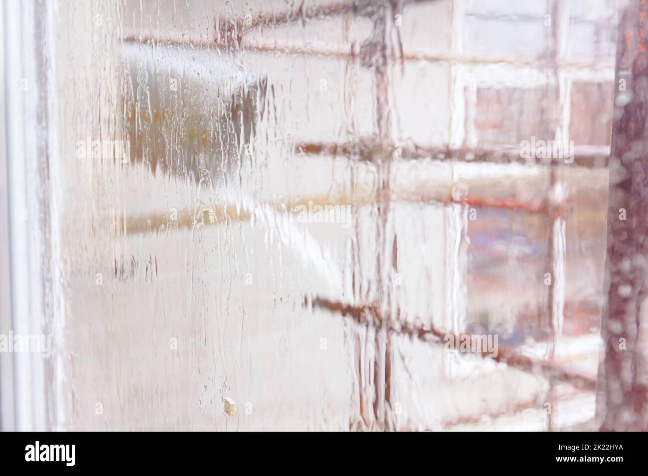 Water drain, temporary gutter on a residential building, rain pours ...