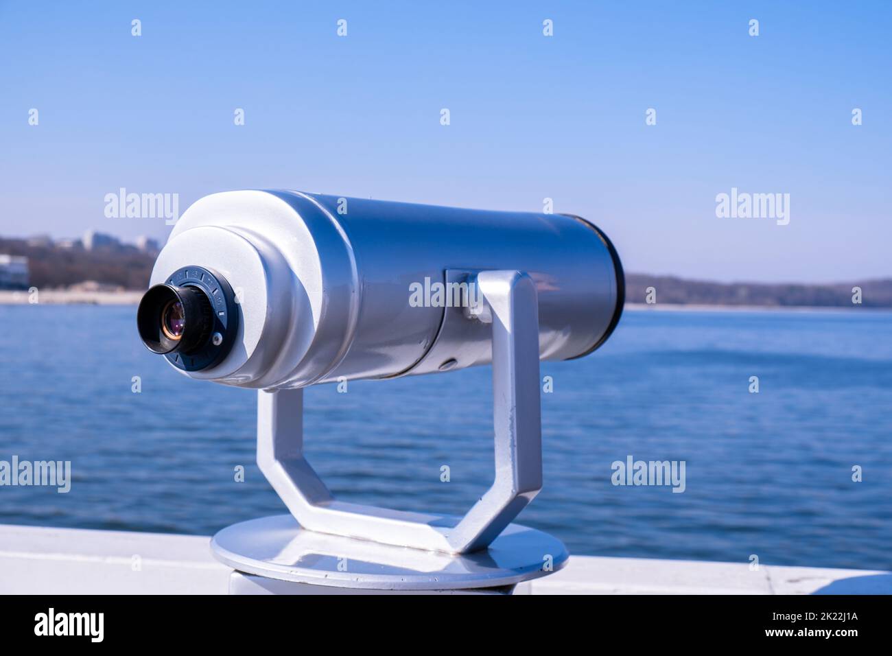 Tourist binoculars. Binocular telescope on the observation deck for tourism. Sea background ...