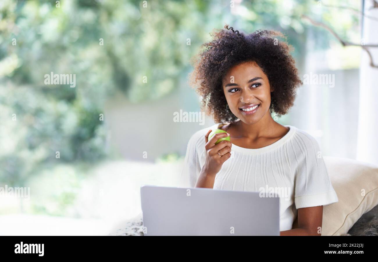 What to search for next...a young woman eating an apple and surfing the ...